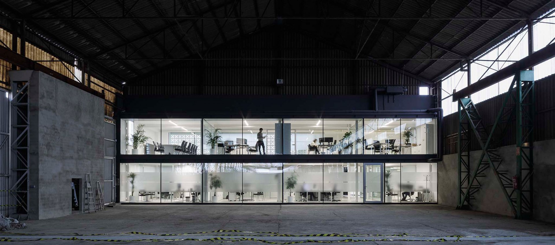 View towards an old industrial warehouse. Trucksur Offices by ...