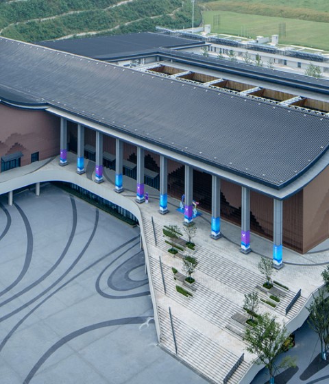 A soccer field as a roof. Indoor Sports Field of Shaoxing University by ...