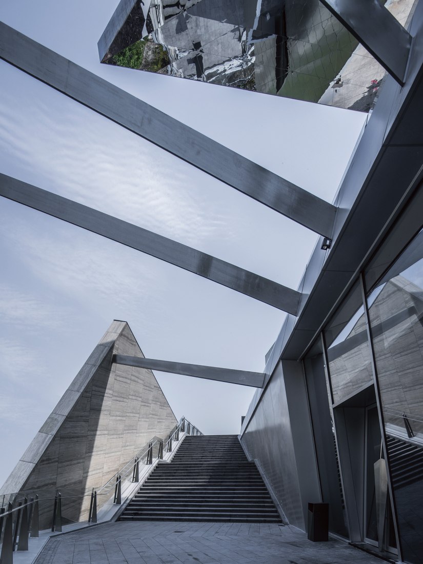 Fragmentation on the cliff. CRCC Chongqing City Park Sales Office by ...