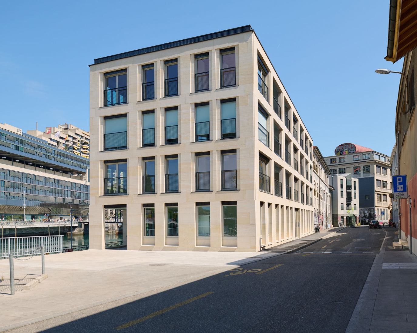 Stone and wood, industry and river. 10 social housing units on the ...