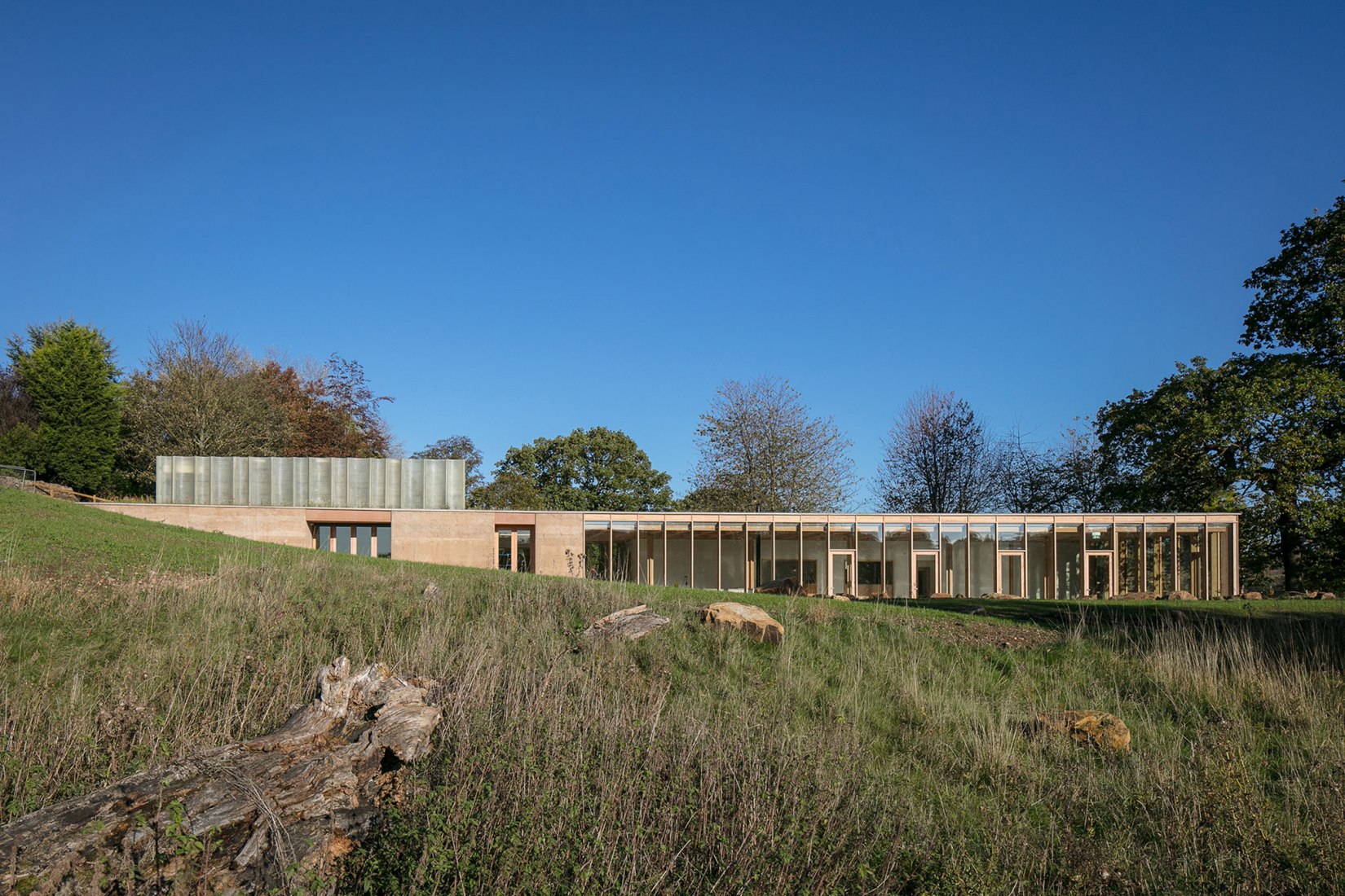 A wall integrated into landscape. The Weston Visitor Centre and Gallery ...