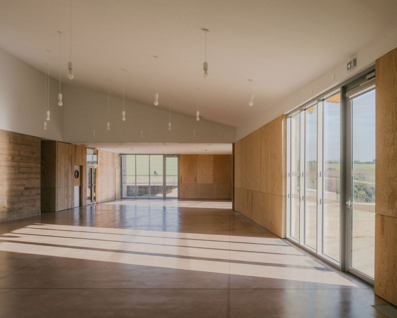 Dialogue with the countryside. Community hall by graal | The Strength ...