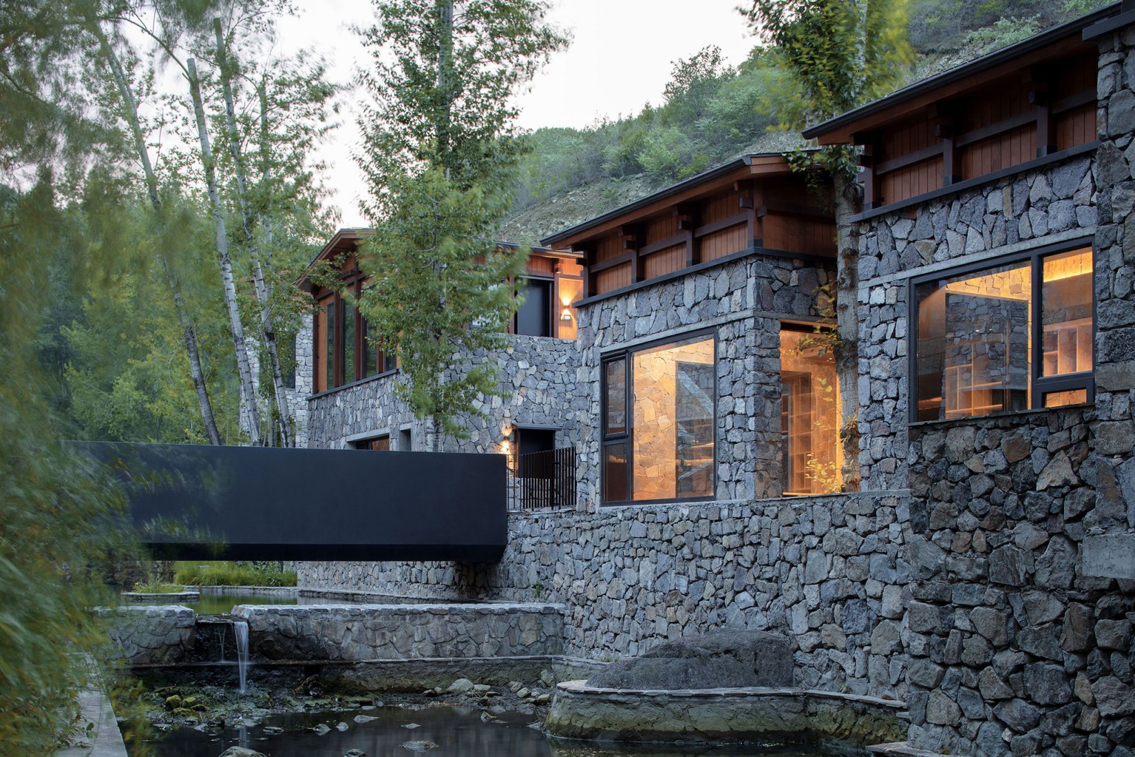 "Naxi" houses on the banks of the river. In S&N Resort by Penda China ...