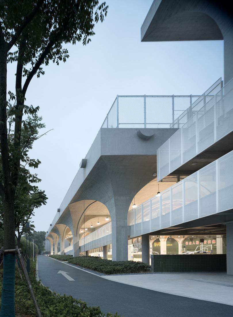 A soccer field as a roof. Indoor Sports Field of Shaoxing University by ...