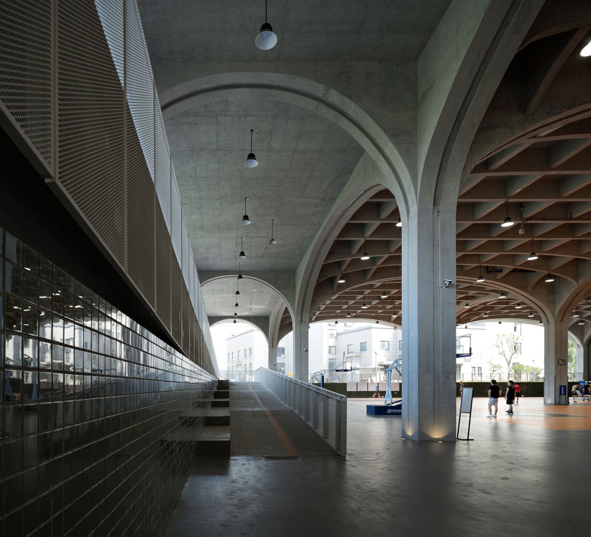A soccer field as a roof. Indoor Sports Field of Shaoxing University by ...