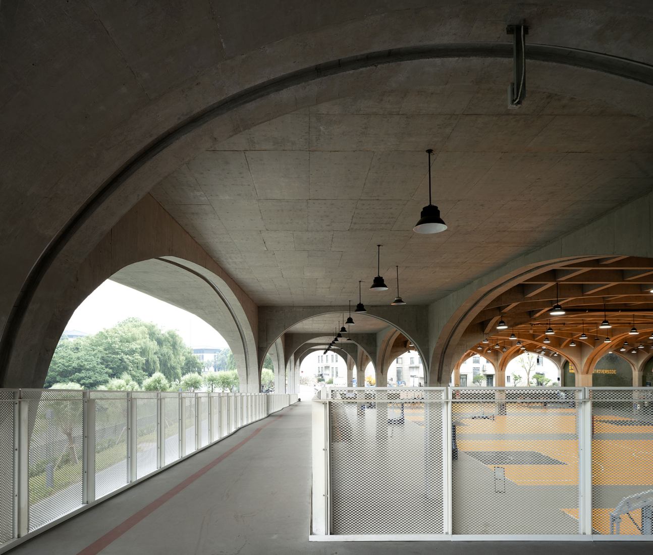 A soccer field as a roof. Indoor Sports Field of Shaoxing University by ...