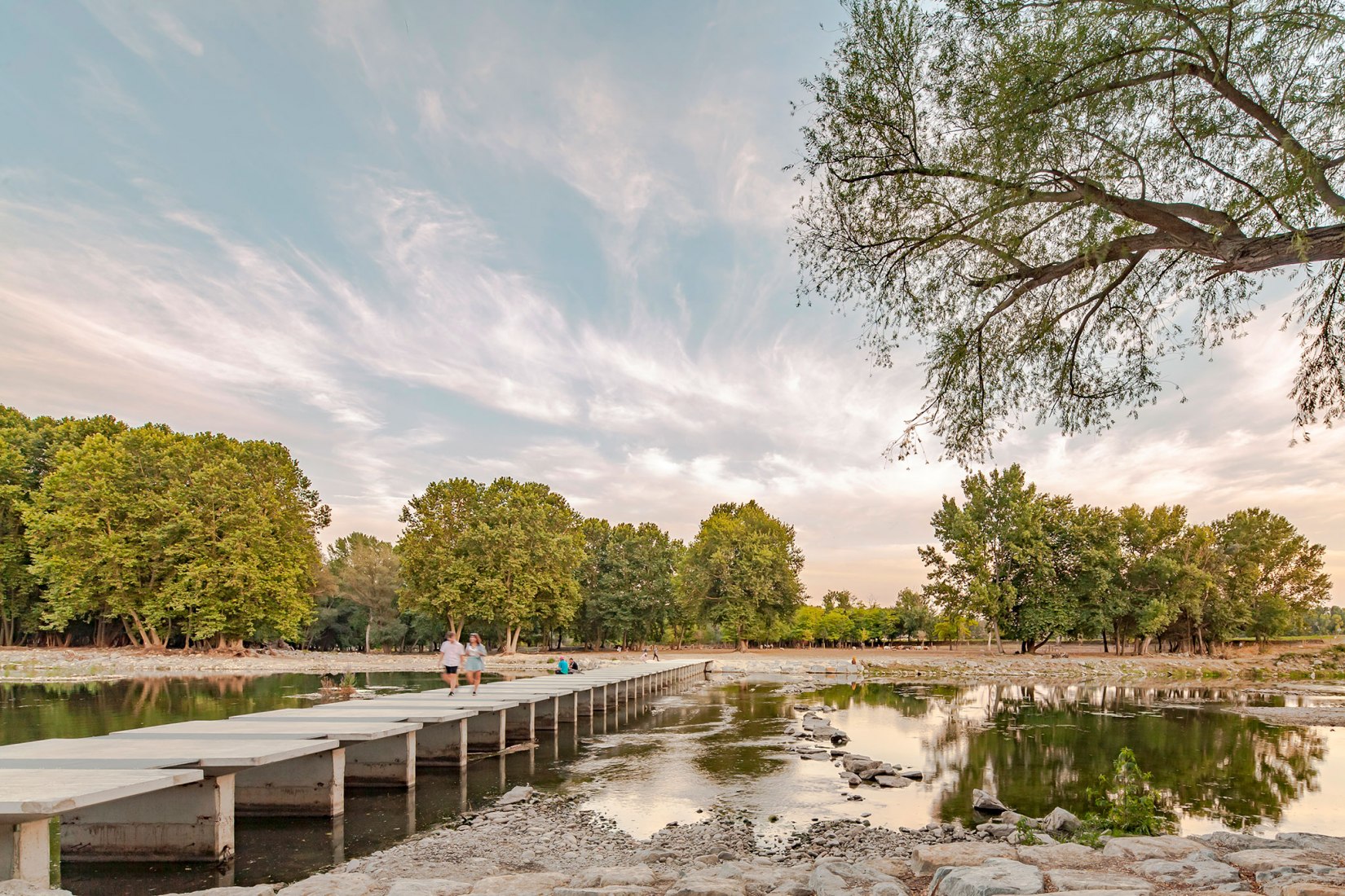 Jump to the other side of the riverbed. Floodable bridge over Ter river ...