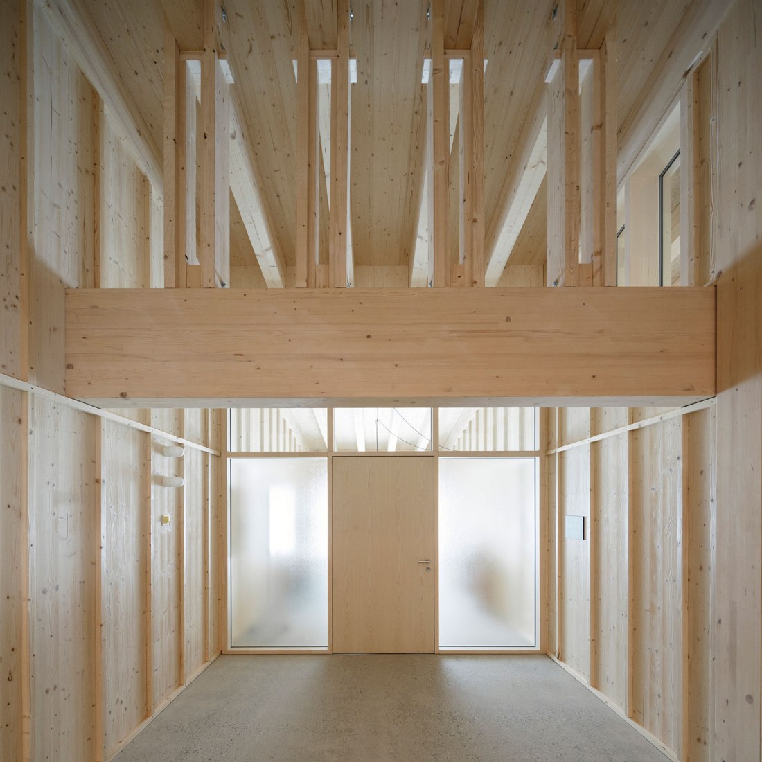 Playing around the central pillar. School in Orsonnens by TED'A ...