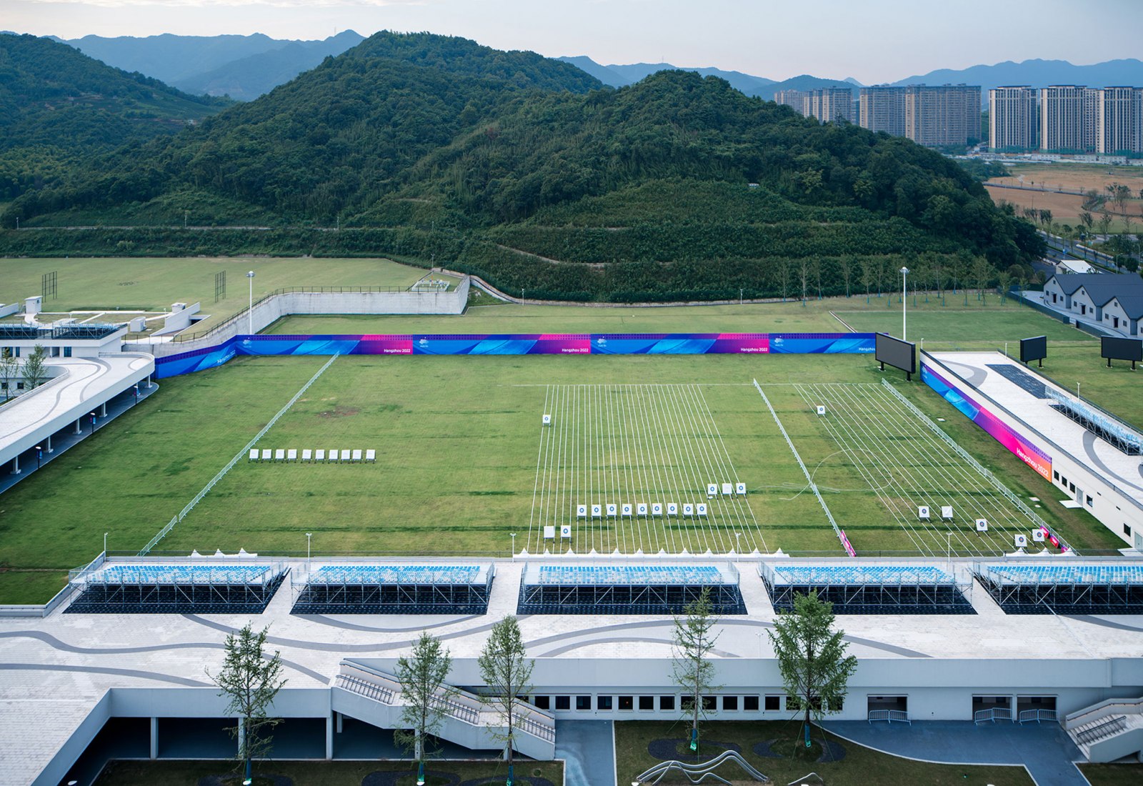 A landscape of terraces for the Asian games. Fuyang Yinhu Sports Center ...
