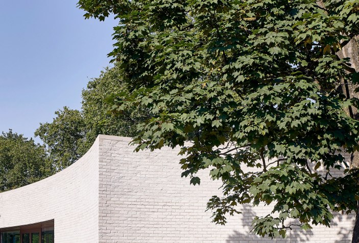 Curves for a white brick pavilion looking at the lake by Bell Philips ...