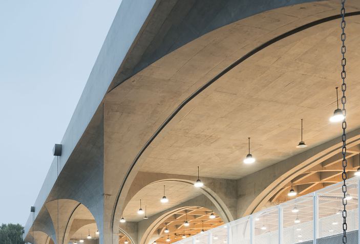 A soccer field as a roof. Indoor Sports Field of Shaoxing University by ...