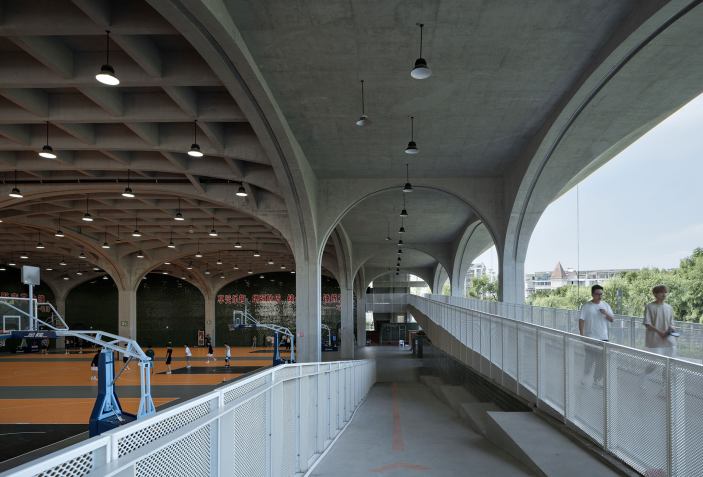 A soccer field as a roof. Indoor Sports Field of Shaoxing University by ...