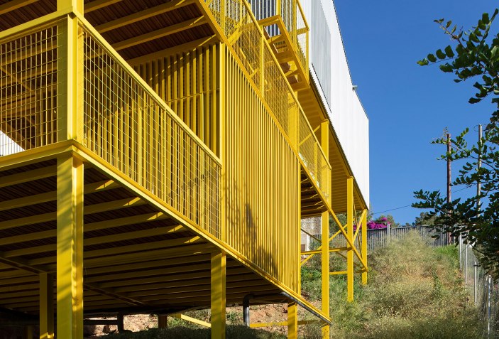 A fragmented house on a slope. rNrH industrialized home by Juan Marco ...