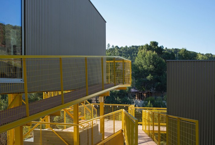 A fragmented house on a slope. rNrH industrialized home by Juan Marco ...