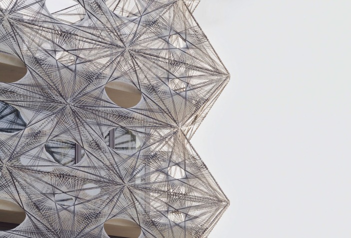 Robotically woven fibers to build a facade. Texoversum Innovation ...
